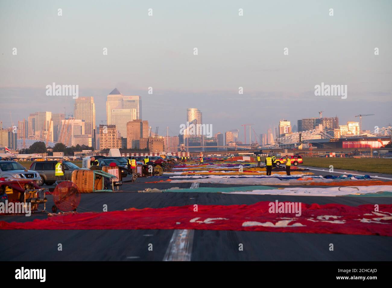 EDITORIAL USE ONLY 30 hot air balloons prepare to lift off from the ...