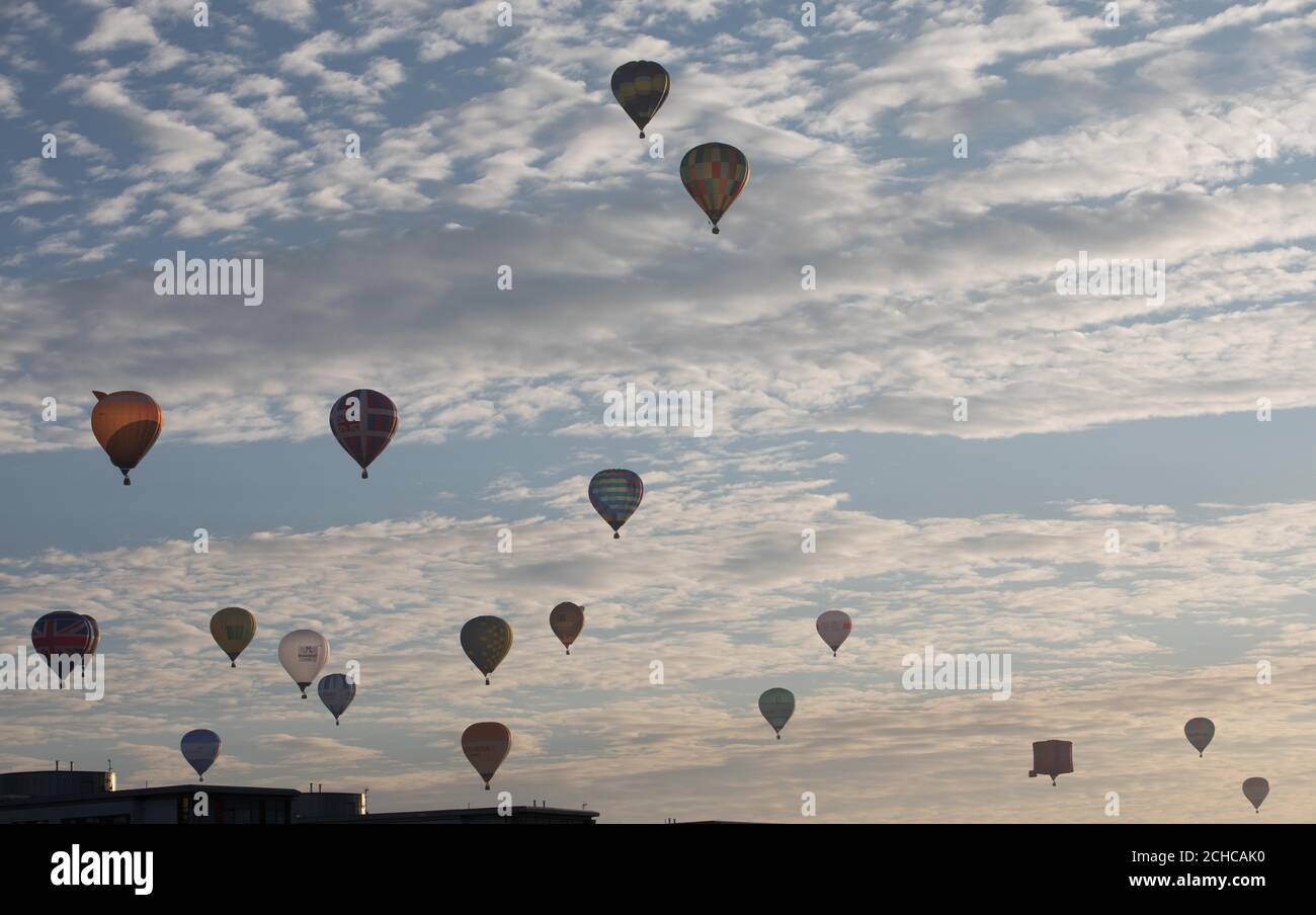 30 hot air balloons lift off from the runway at London City Airport as ...