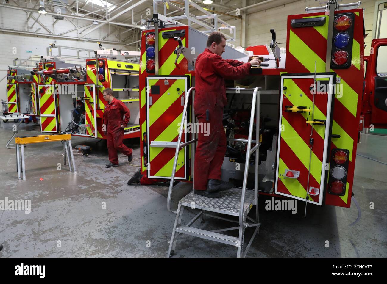 Engineers work on chassis fire engine hi-res stock photography and ...