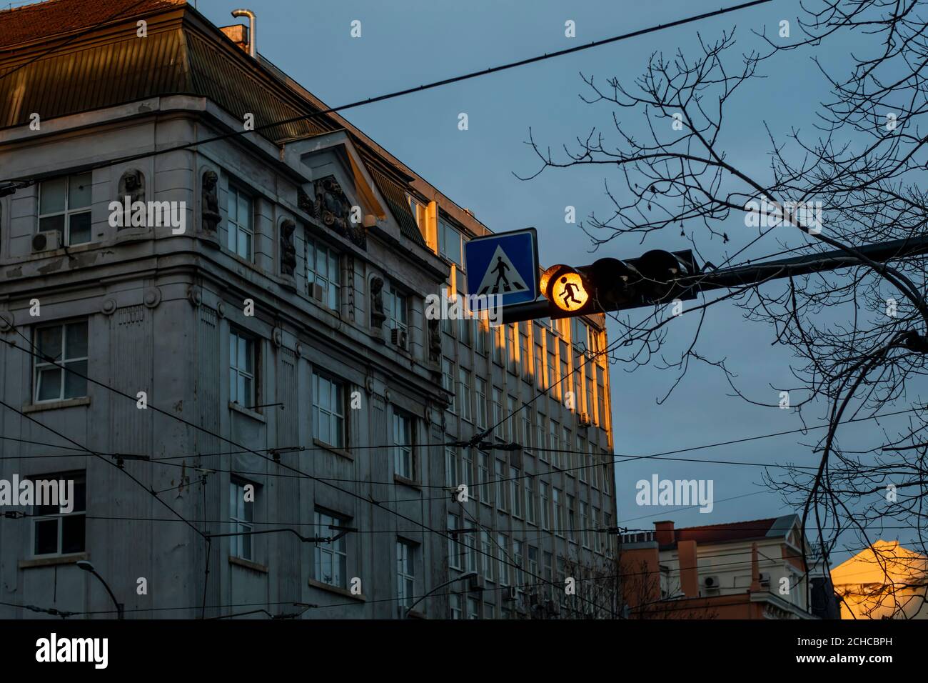 Sign for a zebra cross matches colours with light from a sunset Stock ...