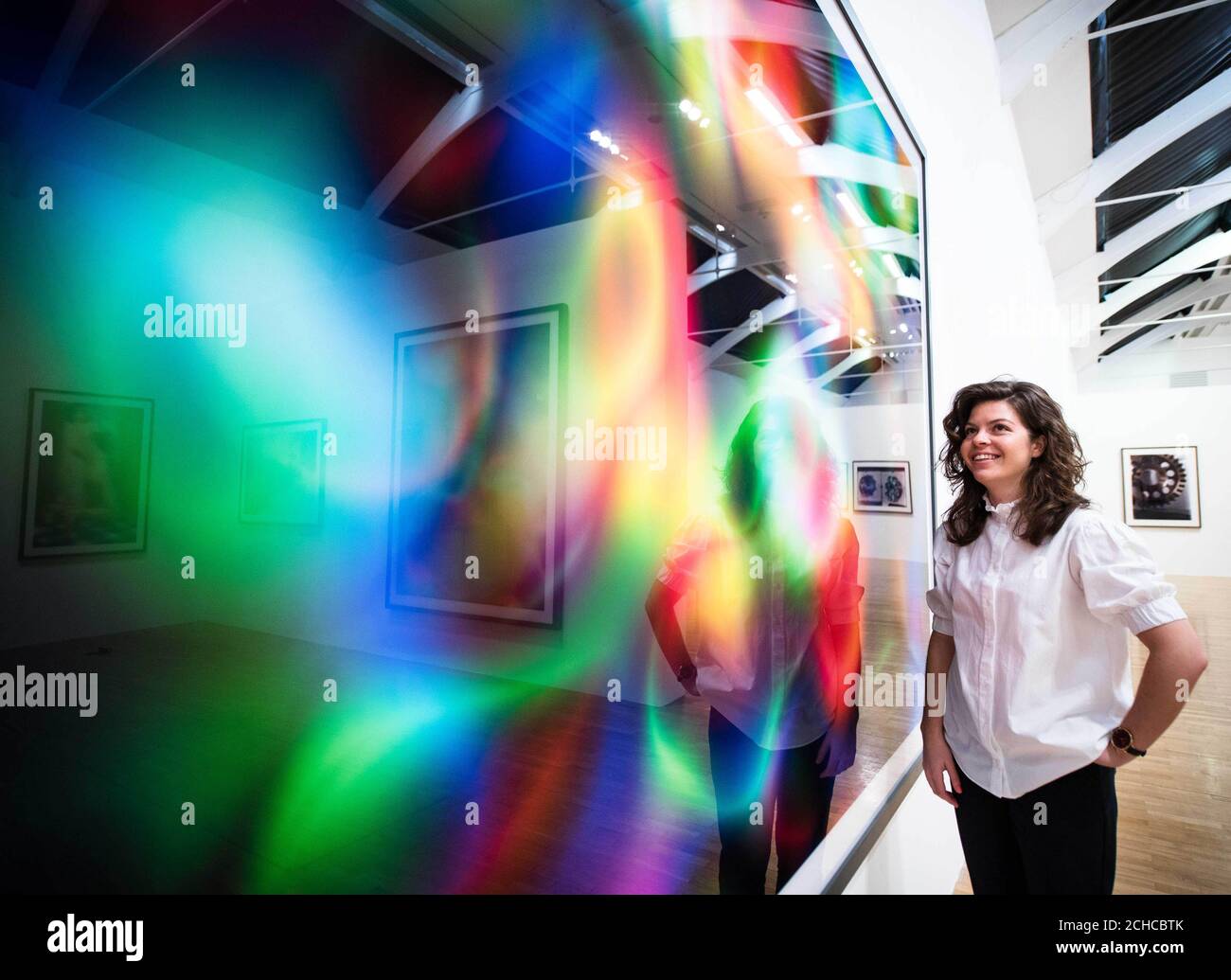 EDITORIAL USE ONLY Gallery staff Jess Roper, look at 'Substrat 3 1 III ...