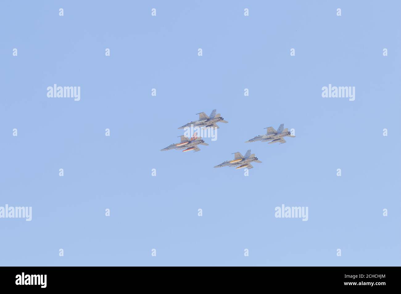 Modern armed military fighter jets flys in formation through the sky ...