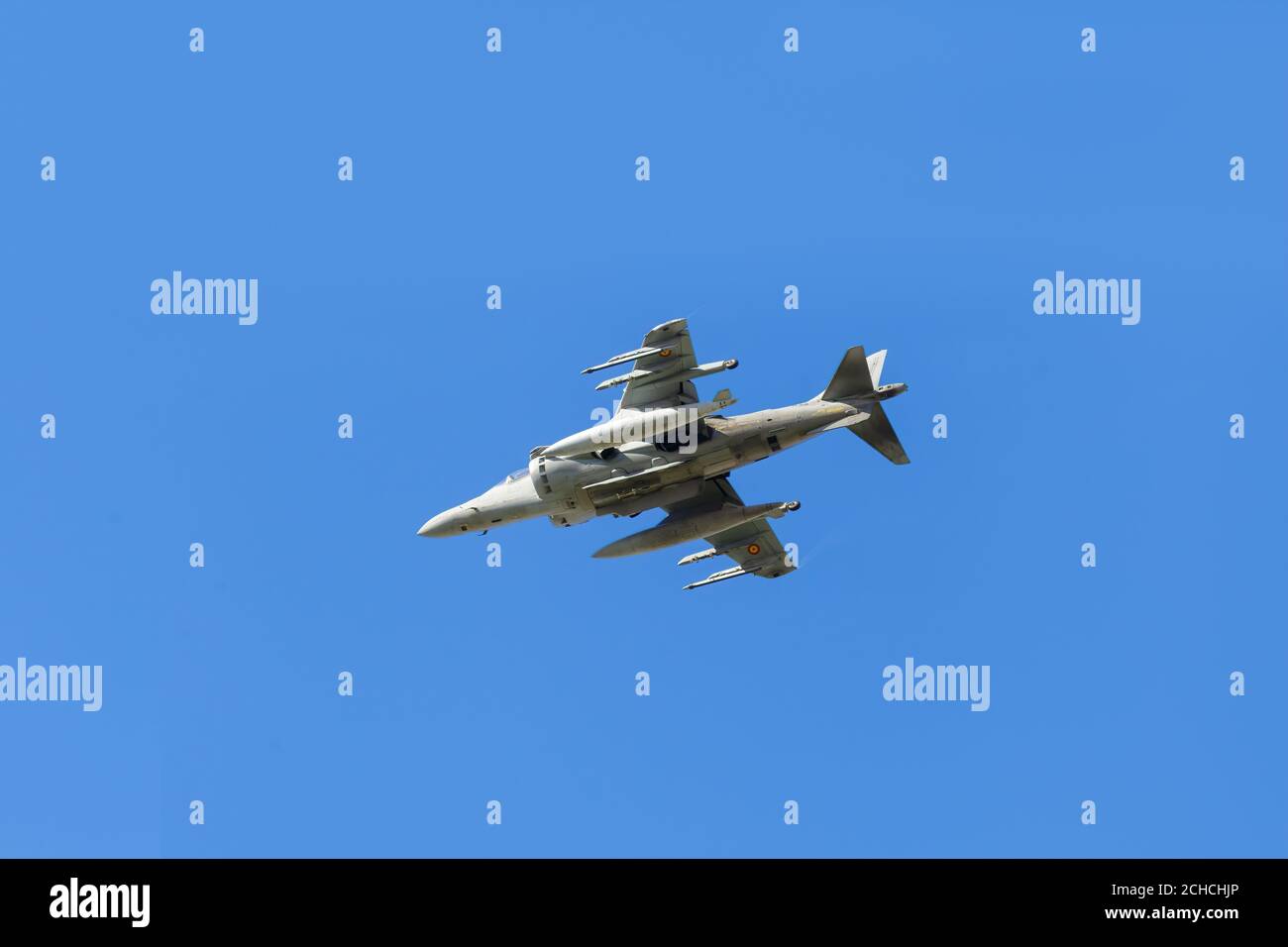 Modern armed military fighter jet flys in formation through the sky ...