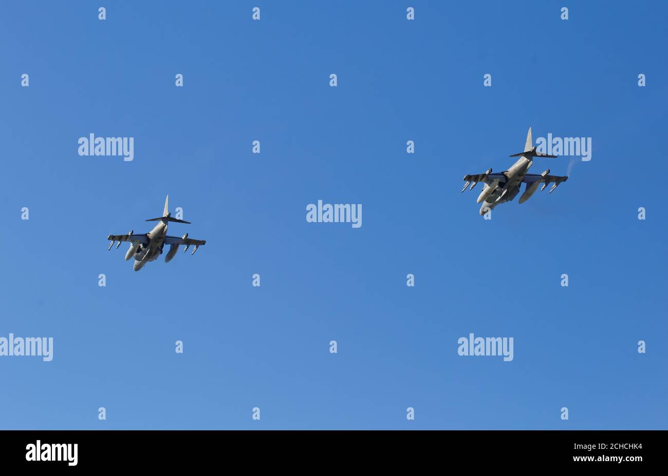 Modern armed military fighter jets flys in formation through the sky ...