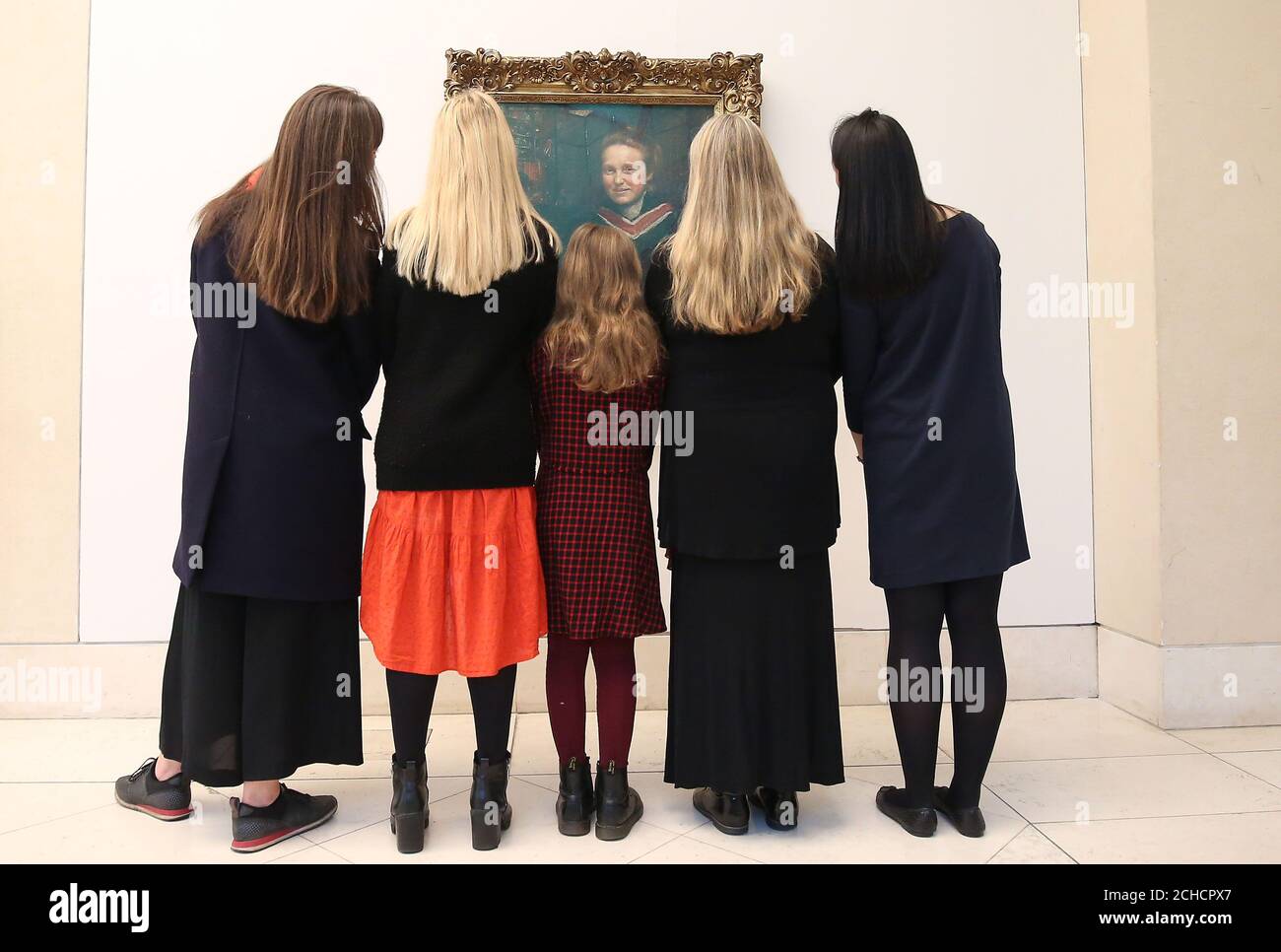 Stella Cartwright aged 9, with Tate Britian staff look at Annie ...
