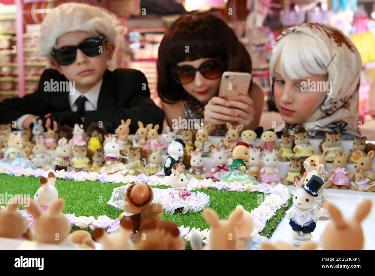 (Left to right) Rufus Rumford, aged eight, dressed as Karl Lagerfeld ...