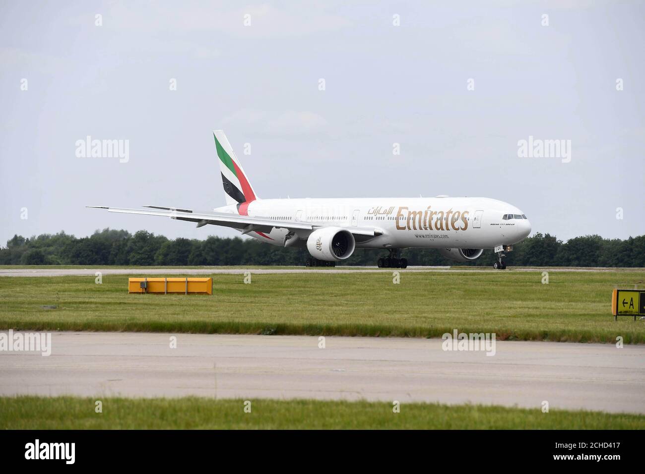 EDITORIAL USE ONLY An Emirates Boeing 777, EK 033, touches down in ...