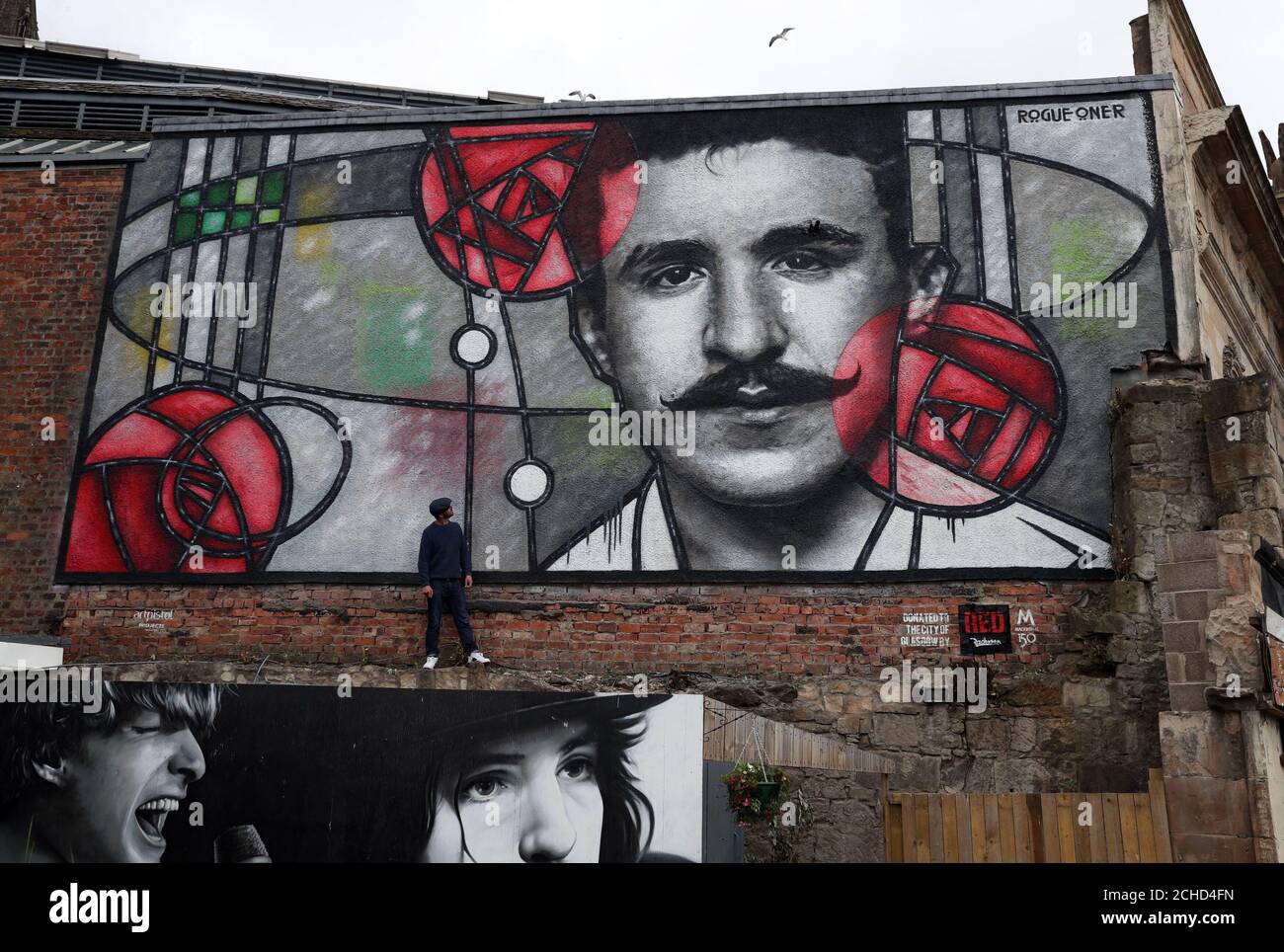 Artist Bobby McNamara known as Rogue-one views his latest work, a giant ...