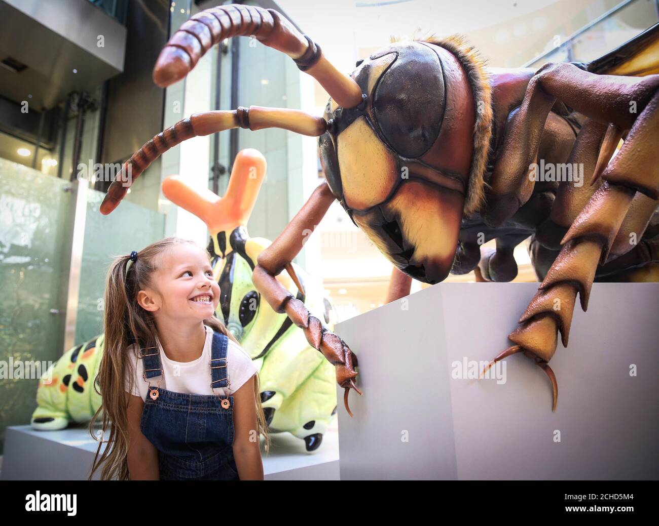 EDITORIAL USE ONLY Eva Riddell, aged 6, interacts with a lifelike model ...