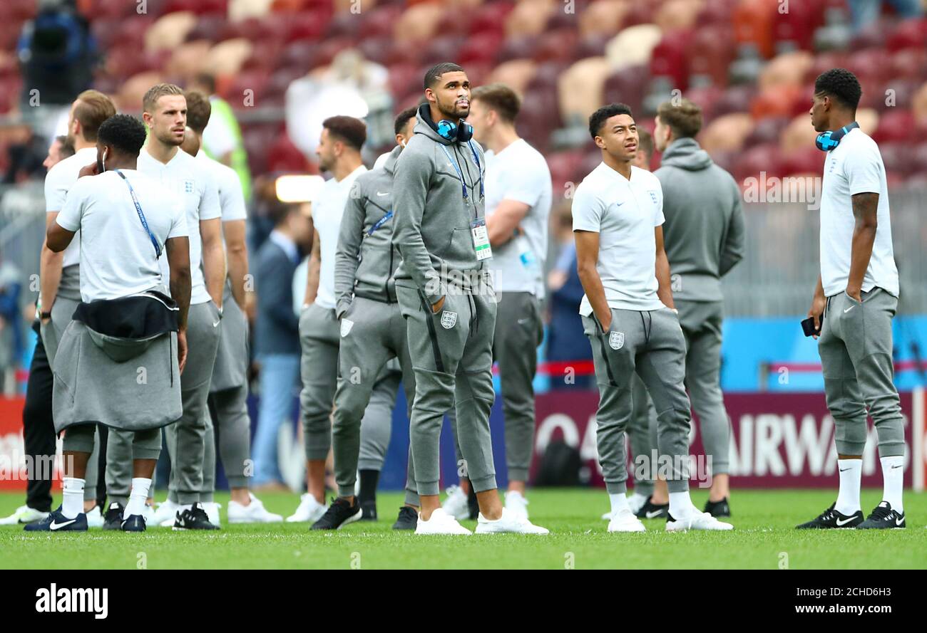 England's Ruben Loftus-Cheek (centre) inspects the pitch ahead of the ...