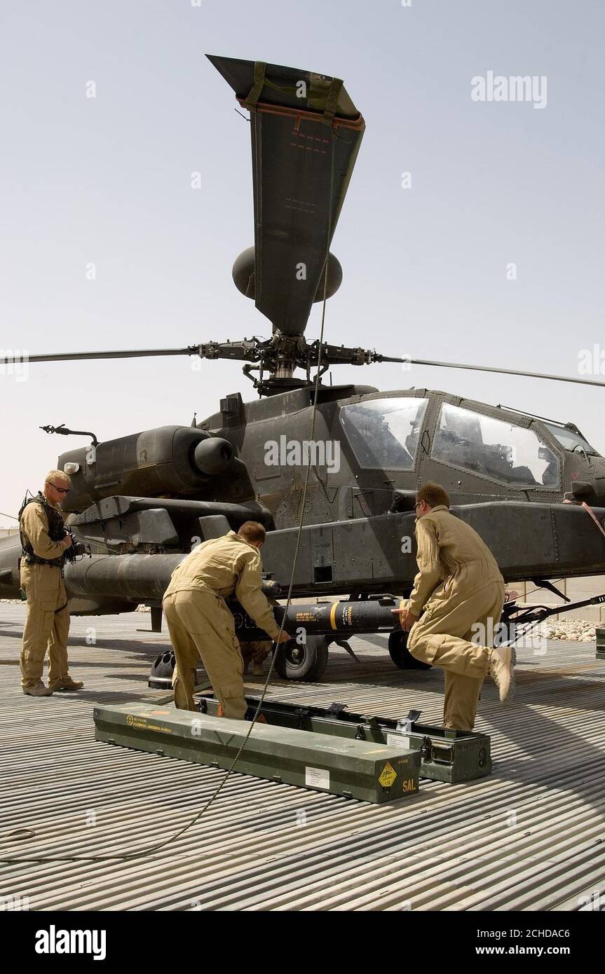 British Army Air Corps Ground Crew re-load a Hellfire Missile onto an ...