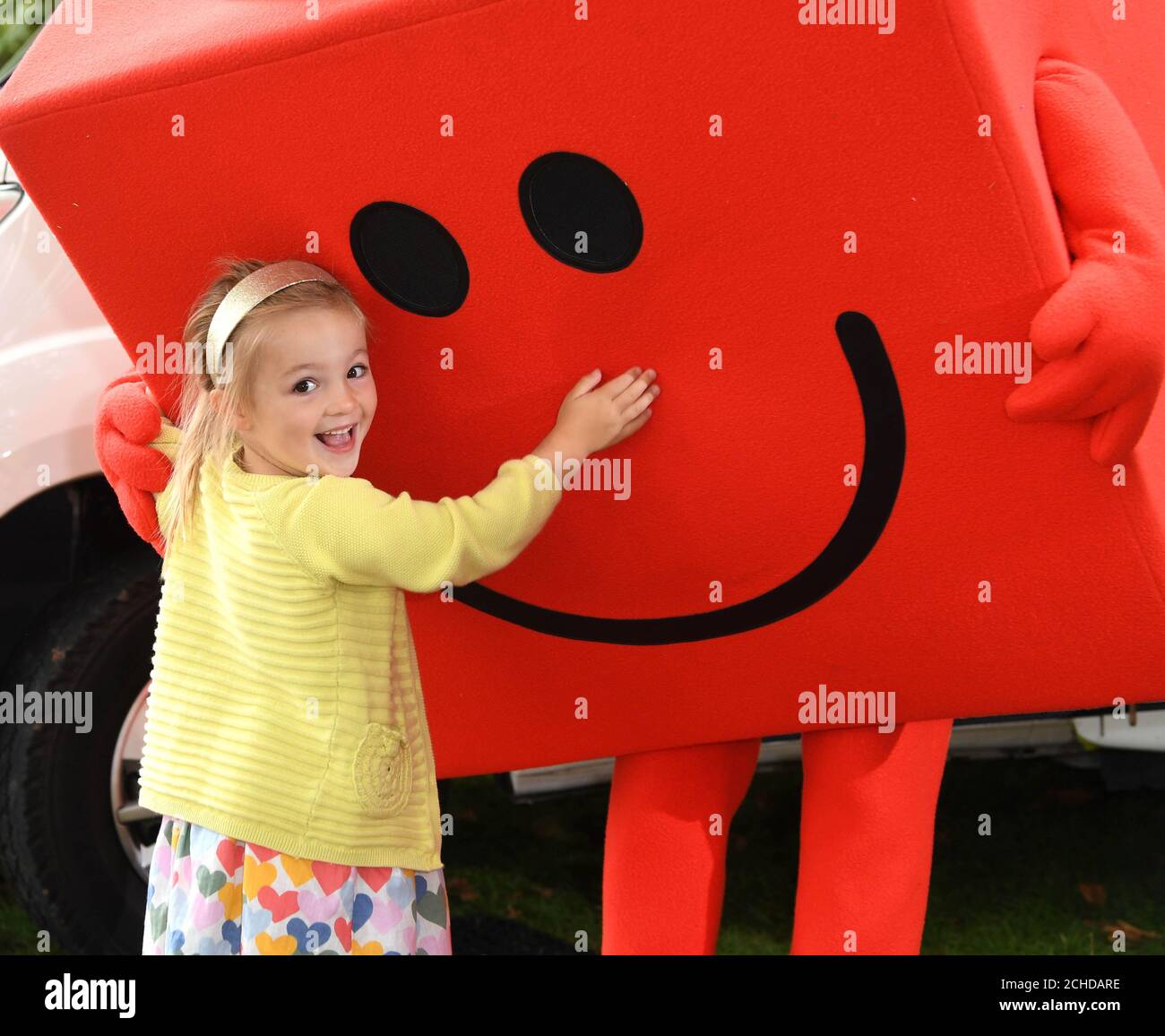 Phoebe Luke, 4, from Farnham, gets a hug from Mr Strong at the launch ...