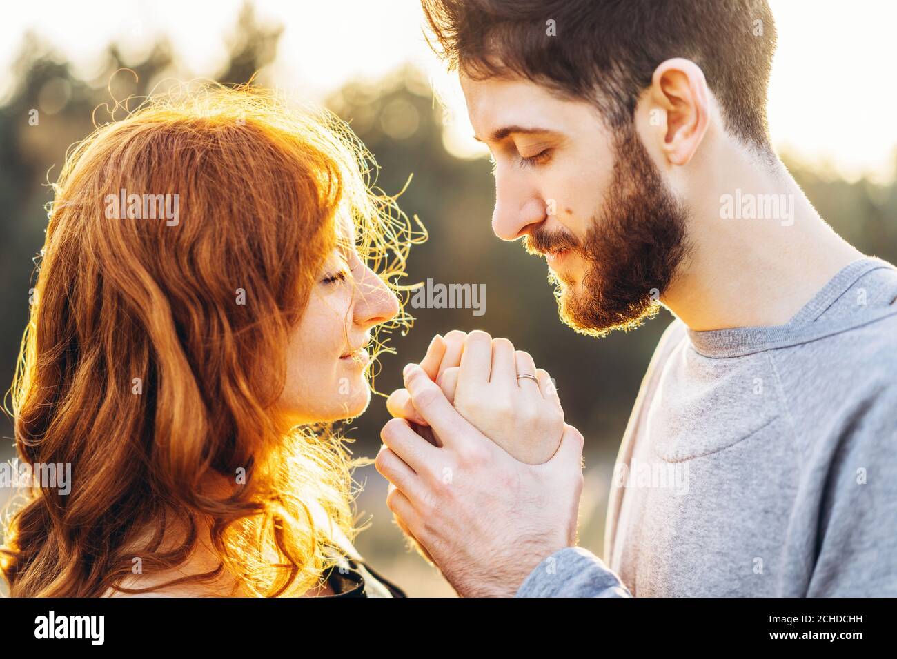 Pretty young romantic couple spend time together outdoor Stock Photo ...