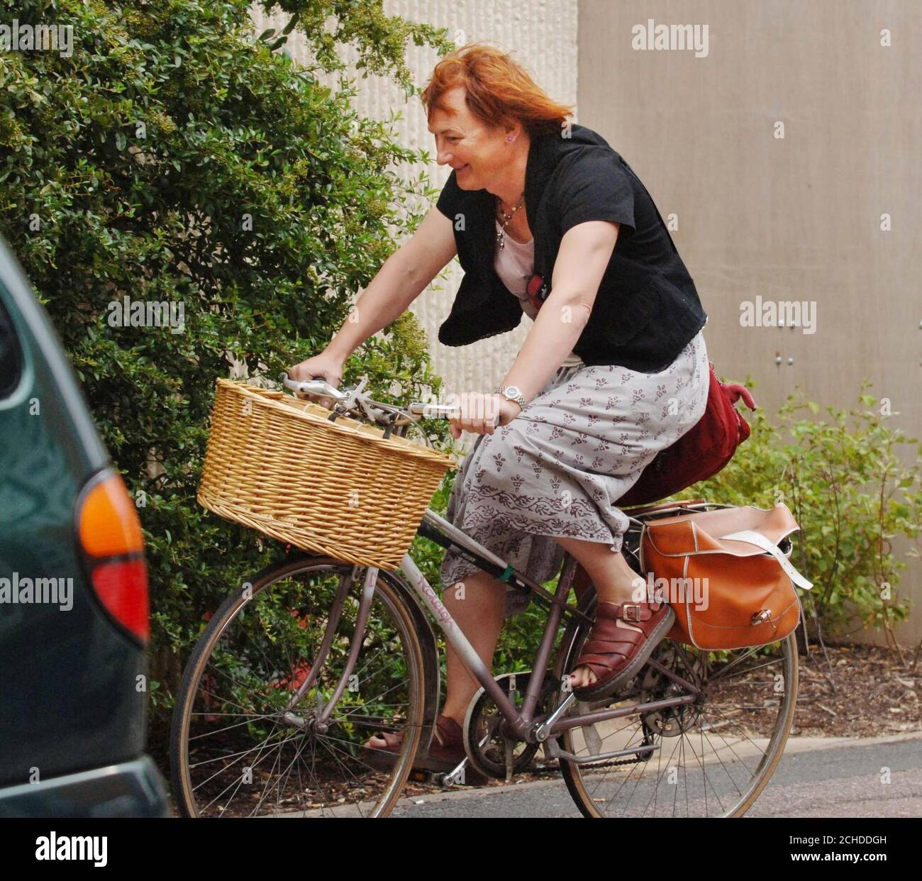 Drusilla Marland rides her bicycle after arriving at the tribunal in ...
