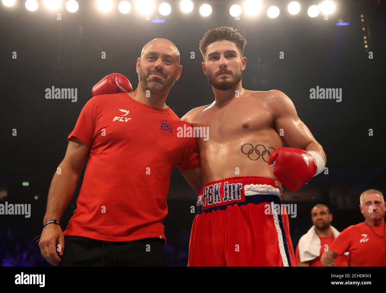 Josh Kelly (right) celebrates with trainer Adam Booth after victory ...