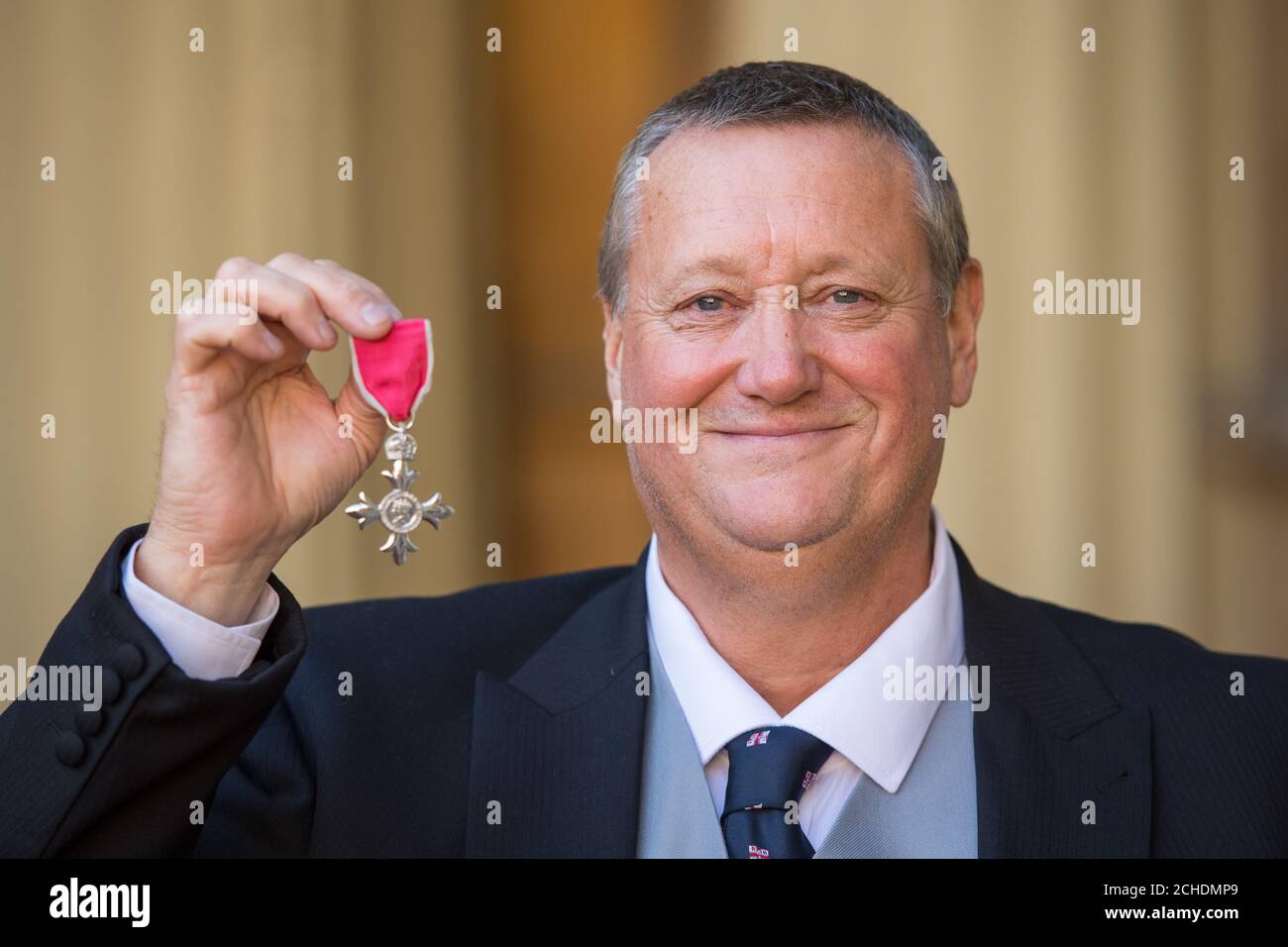 Stanley Todd with his MBE medal, awarded at an investiture ceremony at ...