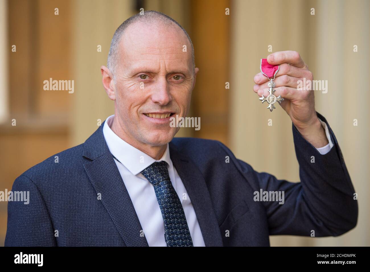 Michael Nield with his MBE medal, awarded at an investiture ceremony at ...