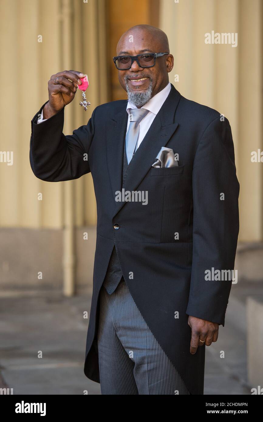 Orphy Robinson with his MBE medal, awarded at an investiture ceremony ...