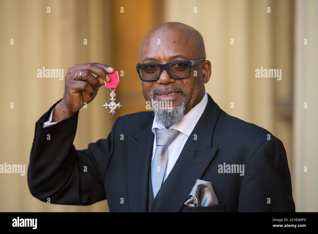 Orphy Robinson with his MBE medal, awarded at an investiture ceremony ...