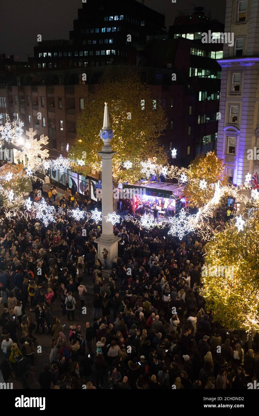 Crowds gather around seven dials monument hi-res stock photography and ...