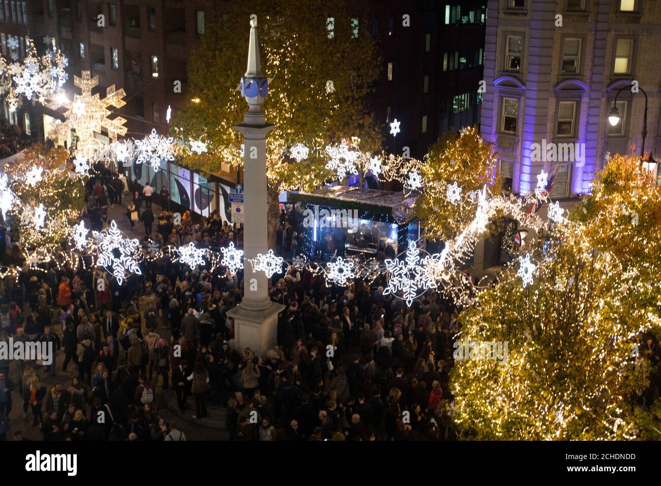 EDITORIAL USE ONLY Crowds gather around the Seven Dials monument in the ...