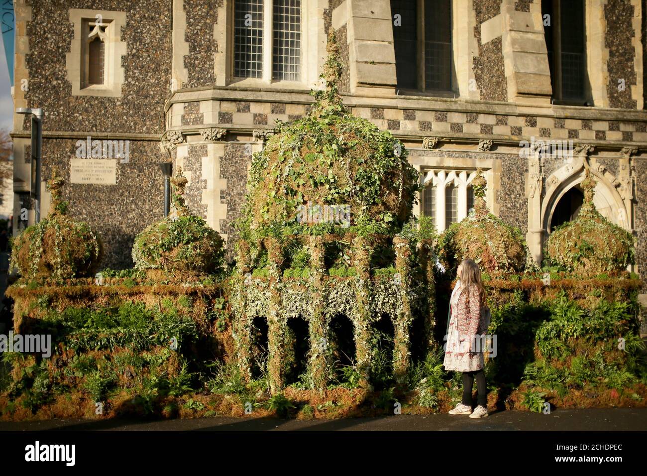 EDITORIAL USE ONLY A passer-by looks at a 12ft tall replica of the ...