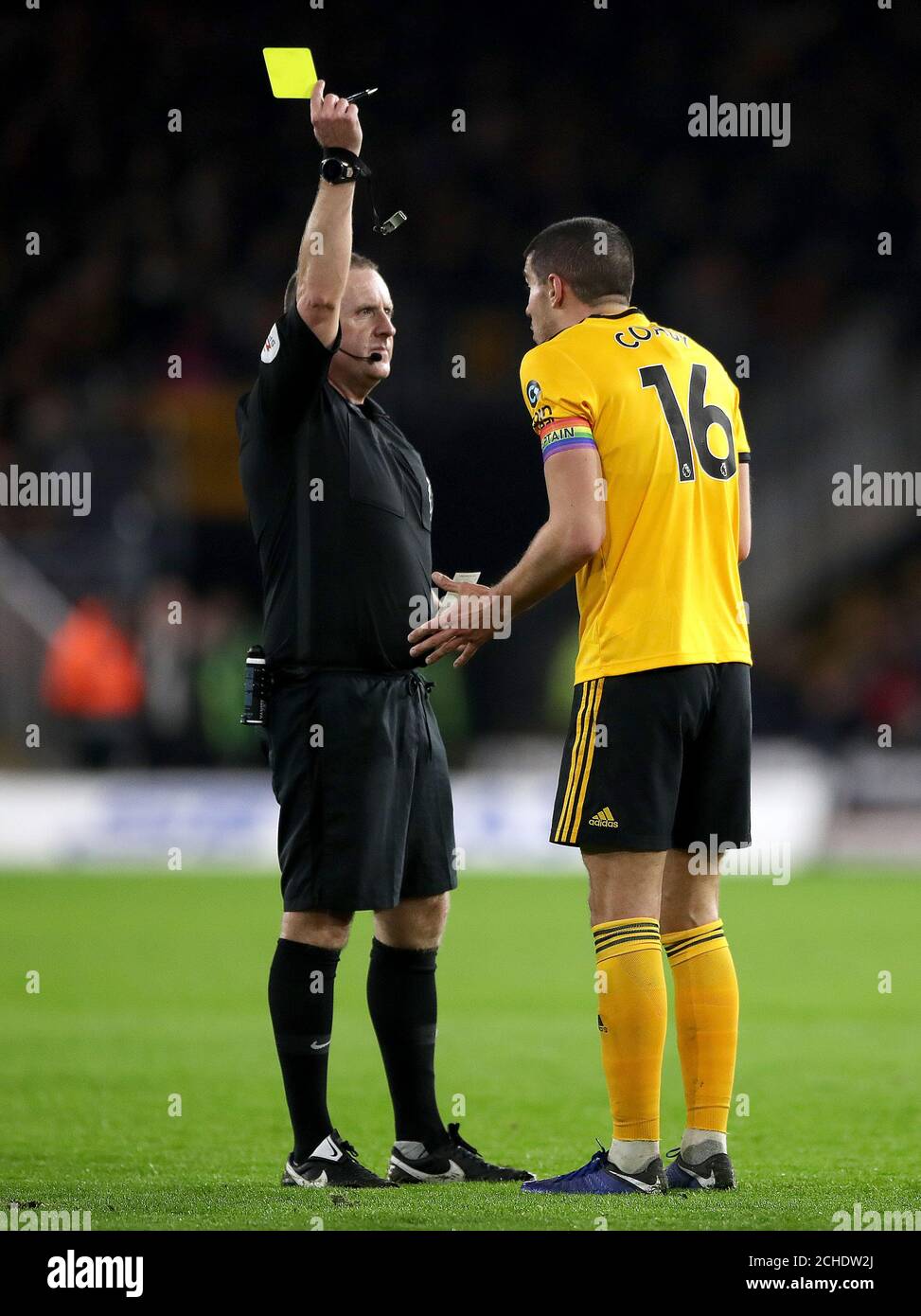 Match referee Jonathan Moss shows a yellow card for dissent to ...