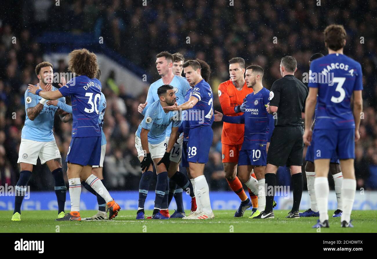 Chelsea players argue with Manchester City's Kyle Walker (left) after a ...