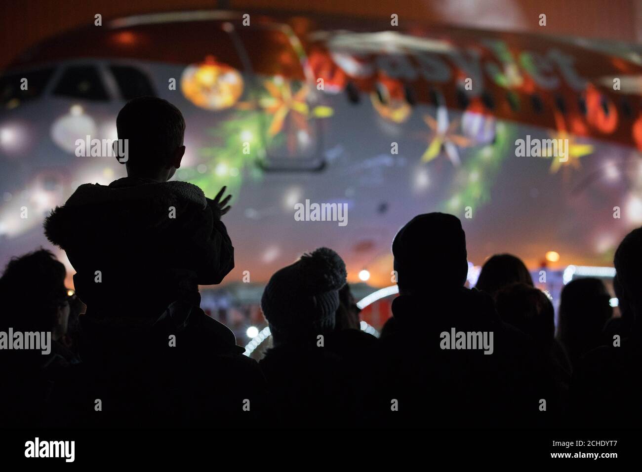 EDITORIAL USE ONLY A Christmas light show illuminates an easyJet A320 ...