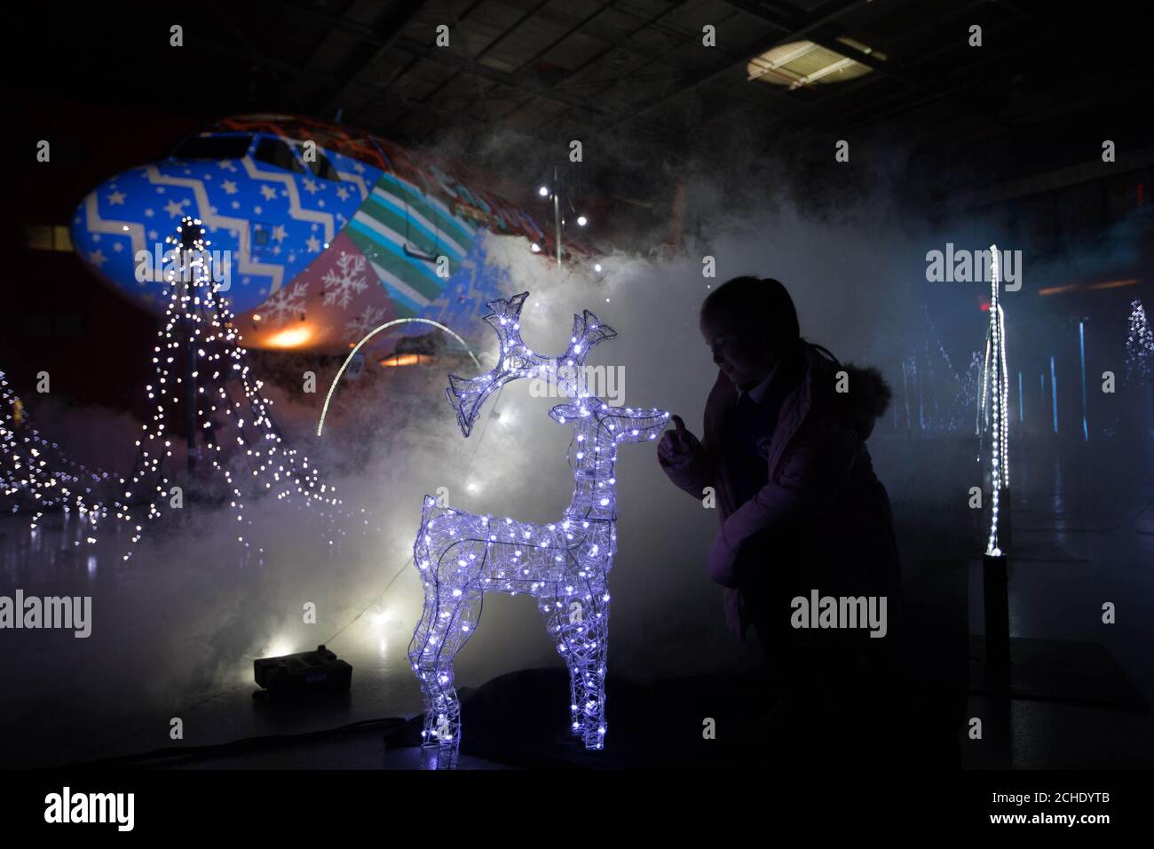 EDITORIAL USE ONLY A Christmas light show illuminates an easyJet A320 ...