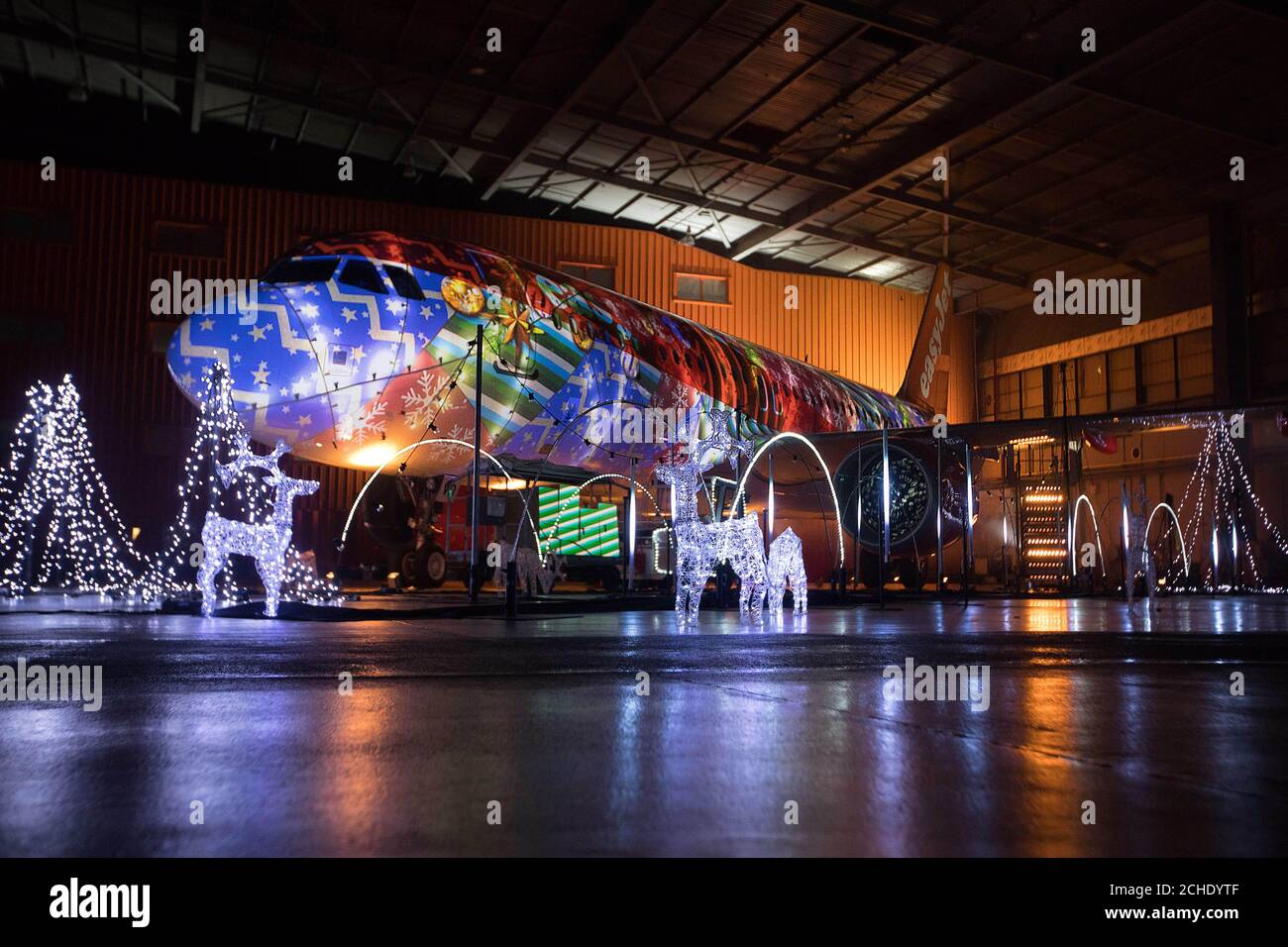 EDITORIAL USE ONLY A Christmas light show illuminates an easyJet A320 ...