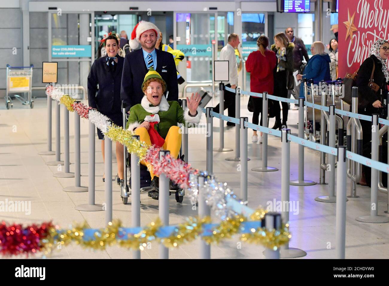 EDITORIAL USE ONLY A Buddy the Elf lookalike checks-in as TUI Airways ...