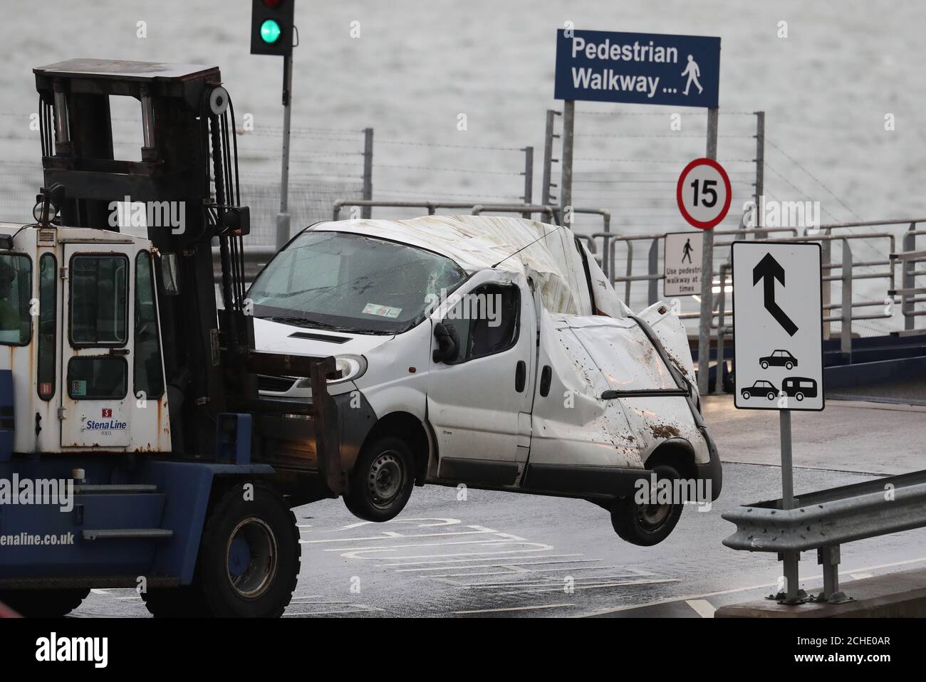 A crushed van is lifted off the European Causeway, a P&O Ferry which ...