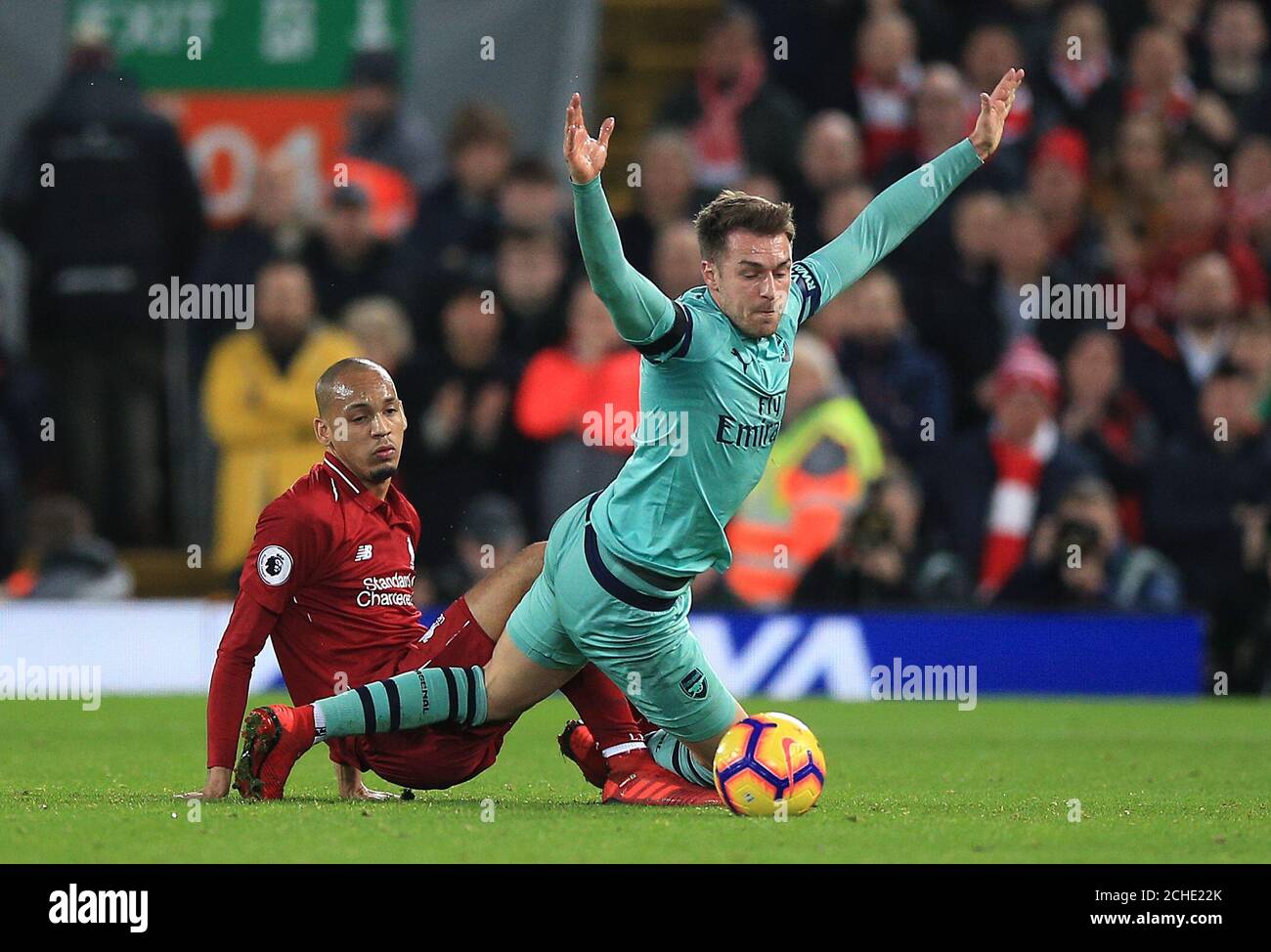 Liverpool's Fabinho (left) challenges Arsenal's Aaron Ramsey during the ...