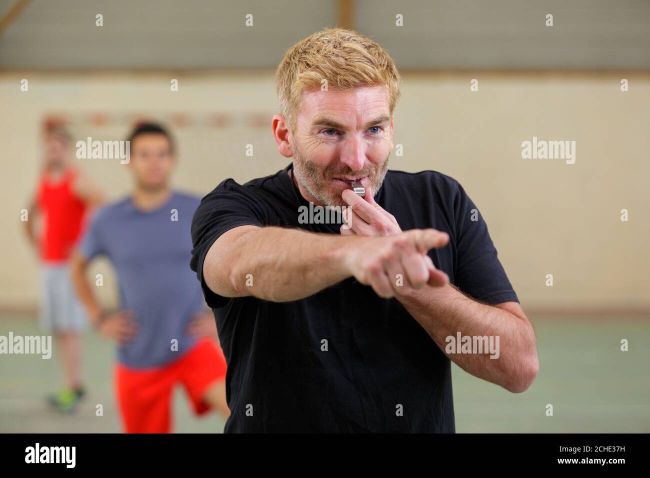 a man referee whilst pointing Stock Photo - Alamy