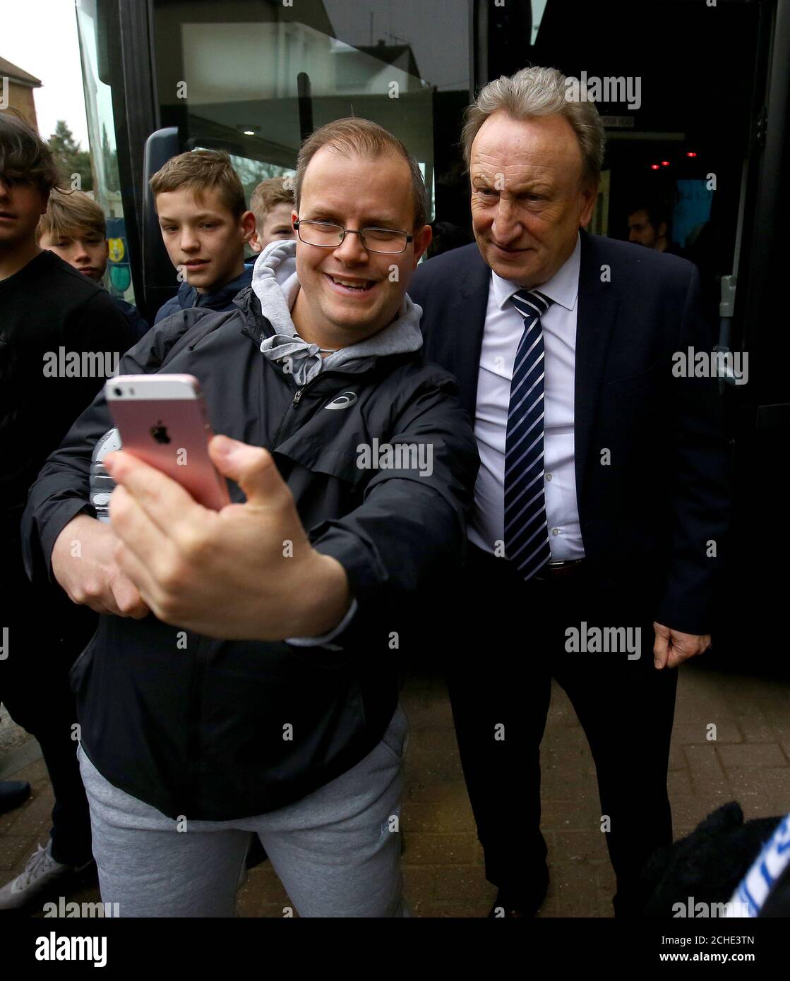 Cardiff City manager Neil Warnock poses for photographs with fans ...