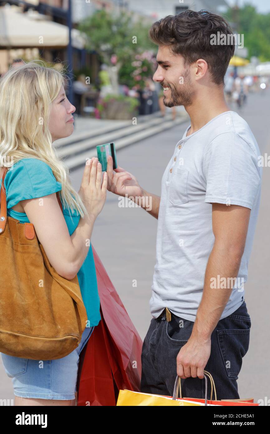 woman refusing card given by boyfriend Stock Photo - Alamy
