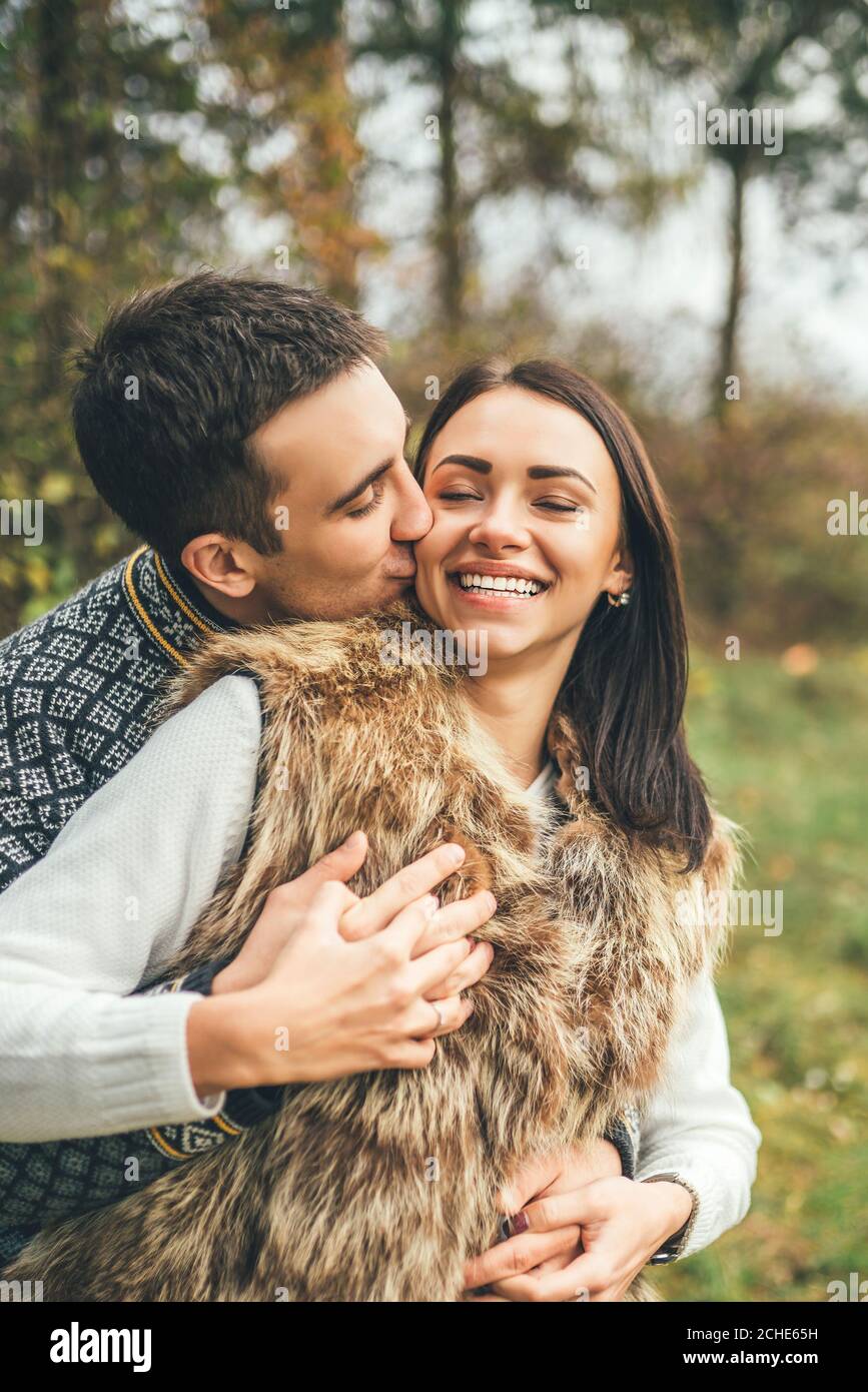 Pretty young couple walking together in the forest Stock Photo - Alamy