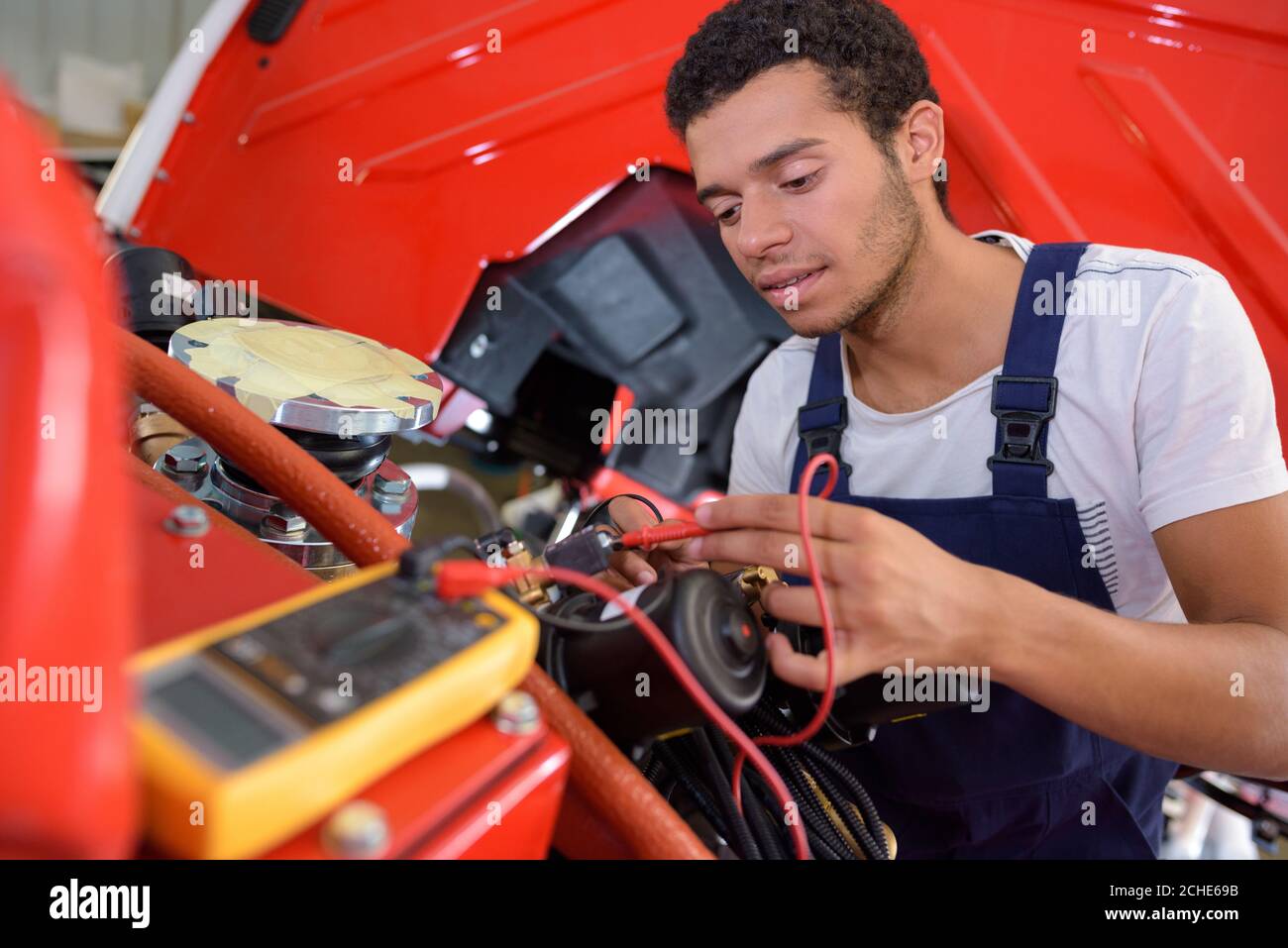 mechanic working on electrical system in the engine Stock Photo - Alamy