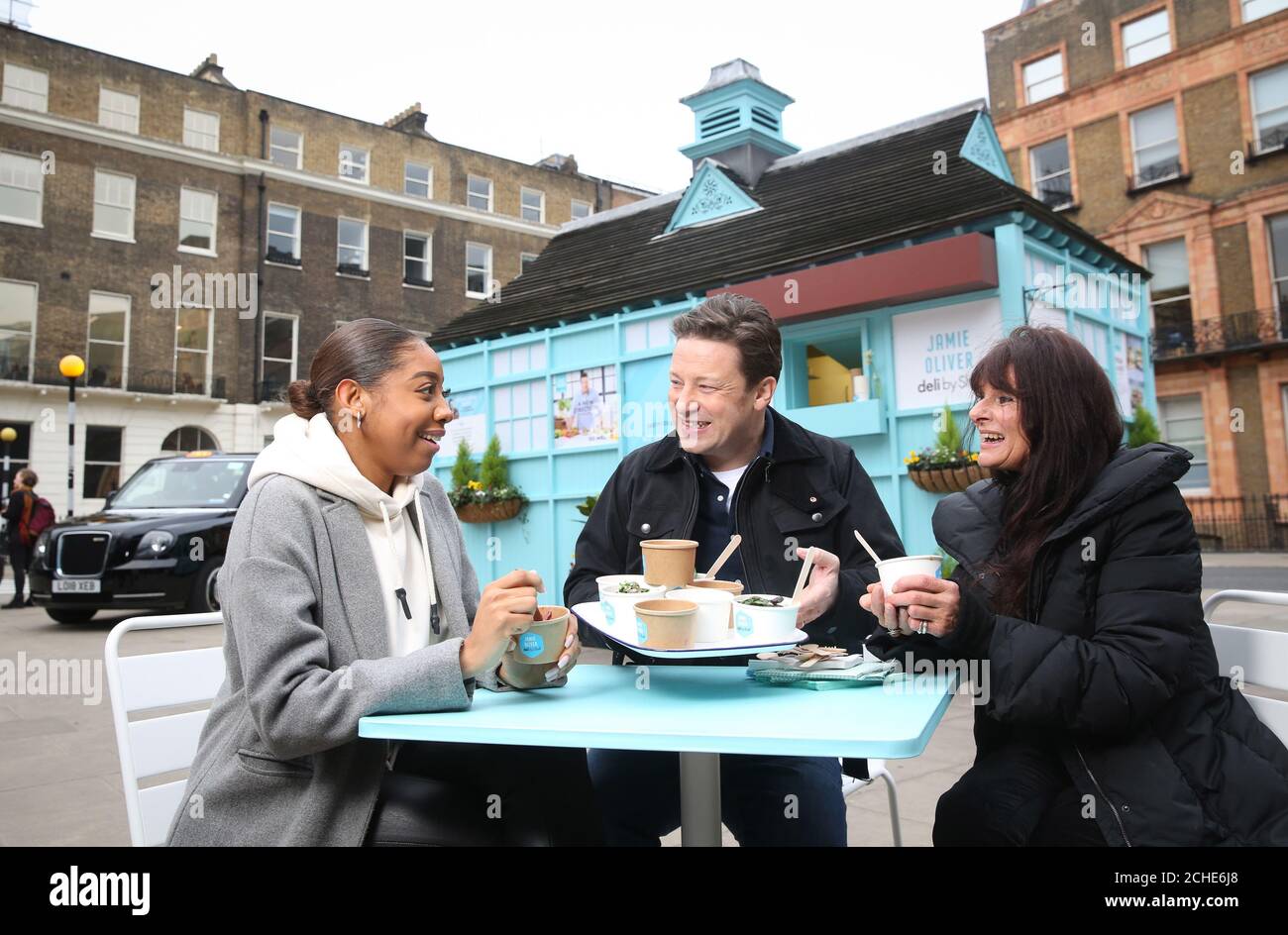 EDITORIAL USE ONLY Jamie Oliver speaks to Milan Charles and Carol ...