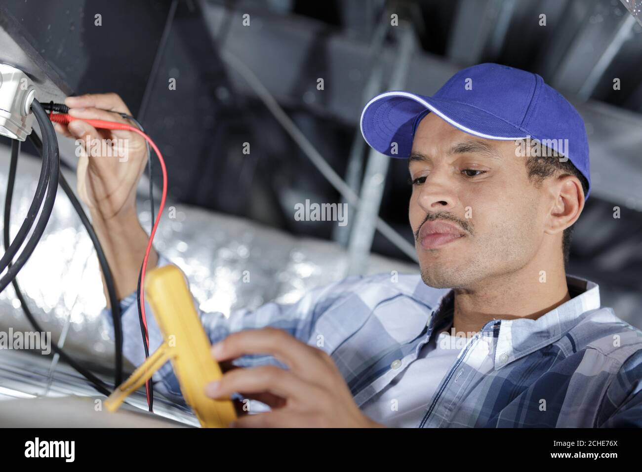 Specialist measuring voltage in circuit hi-res stock photography and ...