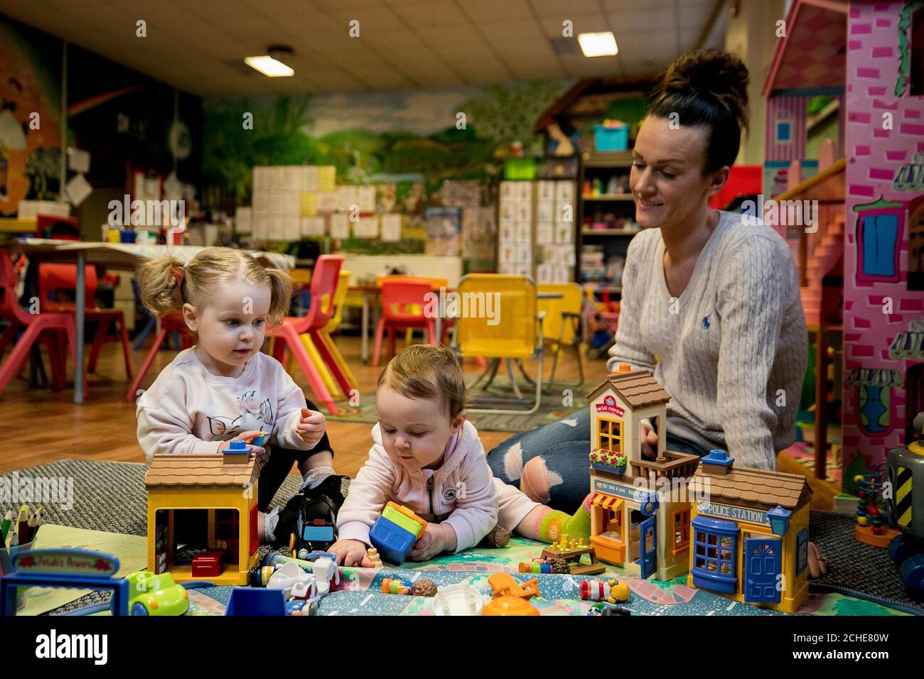 Claire Magill watches her daughters Thea (left) and Avery at a ...