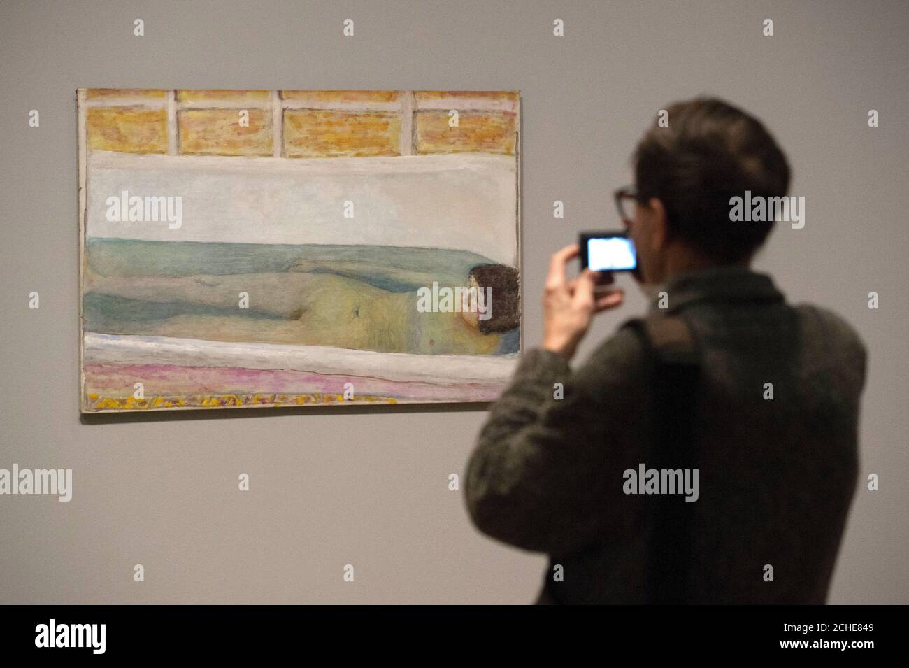 A visitor takes a photograph of The Bath, during a press preview for ...