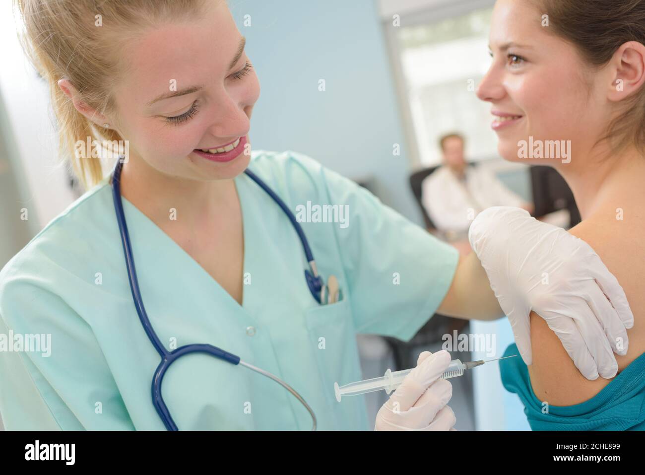 nurse giving the female patient with injection Stock Photo - Alamy