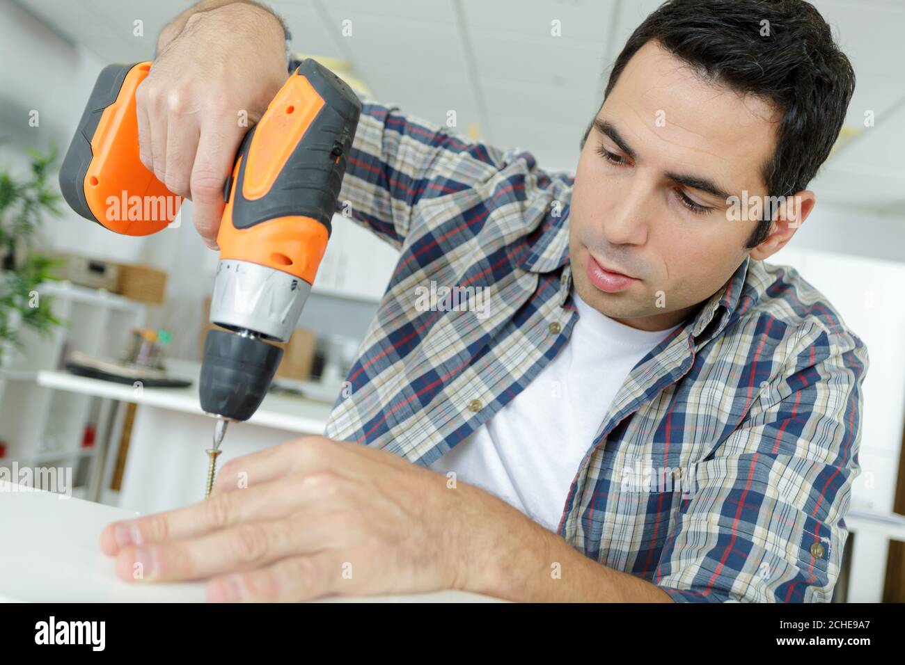 drilling the holes in furniture Stock Photo - Alamy