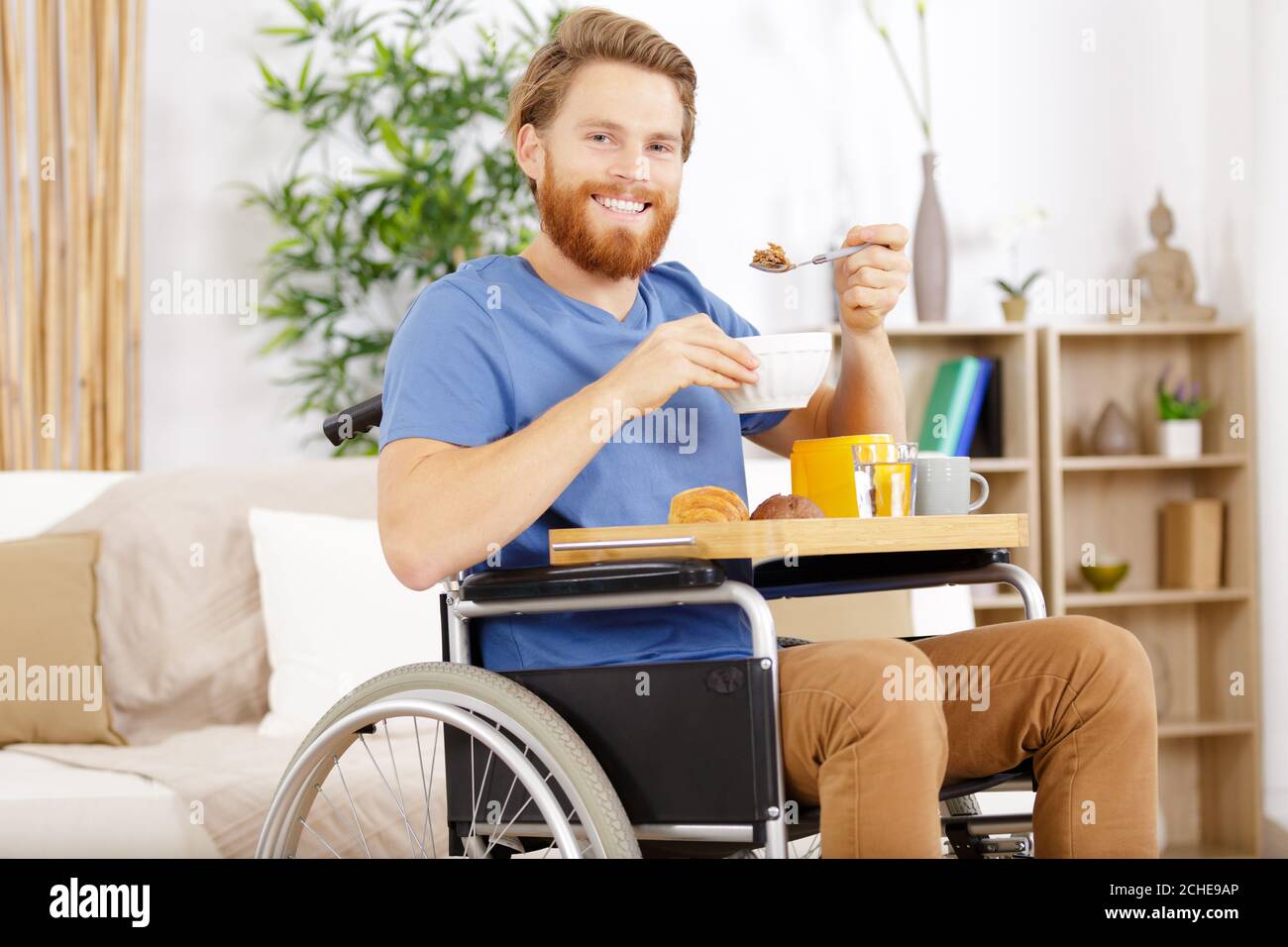 young disabled injured man eating Stock Photo - Alamy
