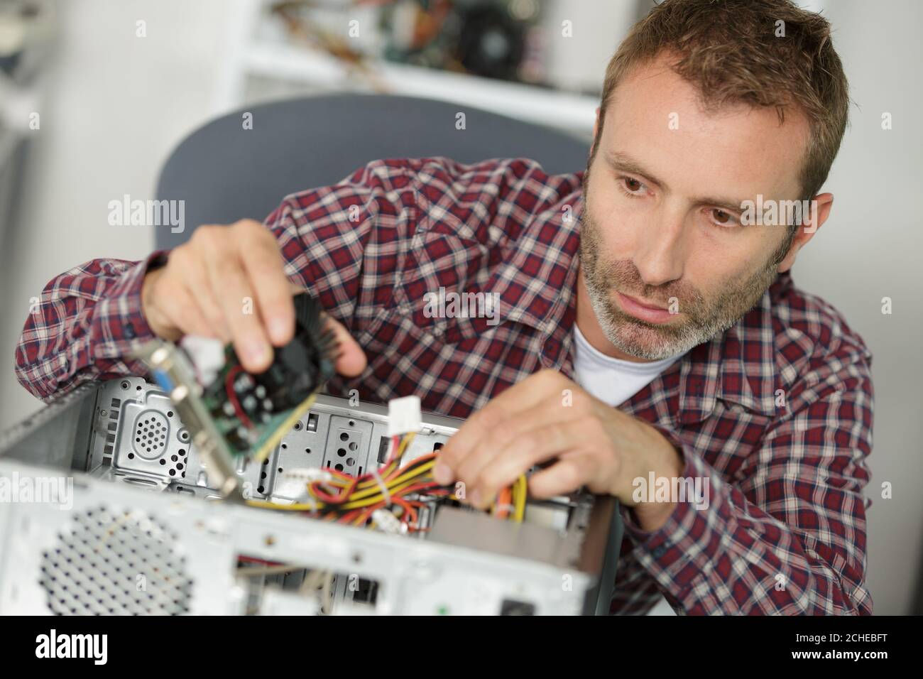 Electrician fixing a electronic device hi-res stock photography and ...
