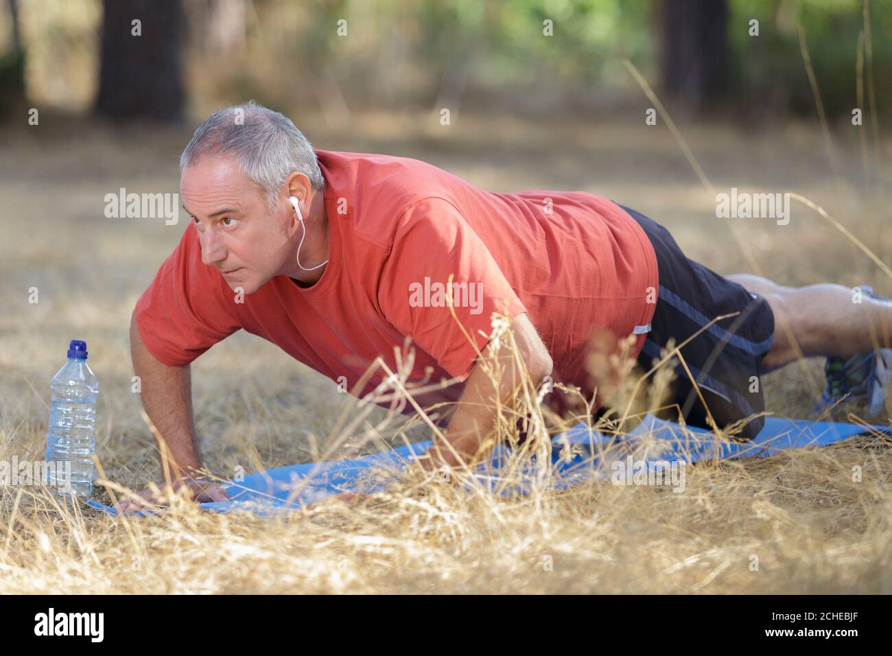 middle age man doing plank exercise Stock Photo - Alamy