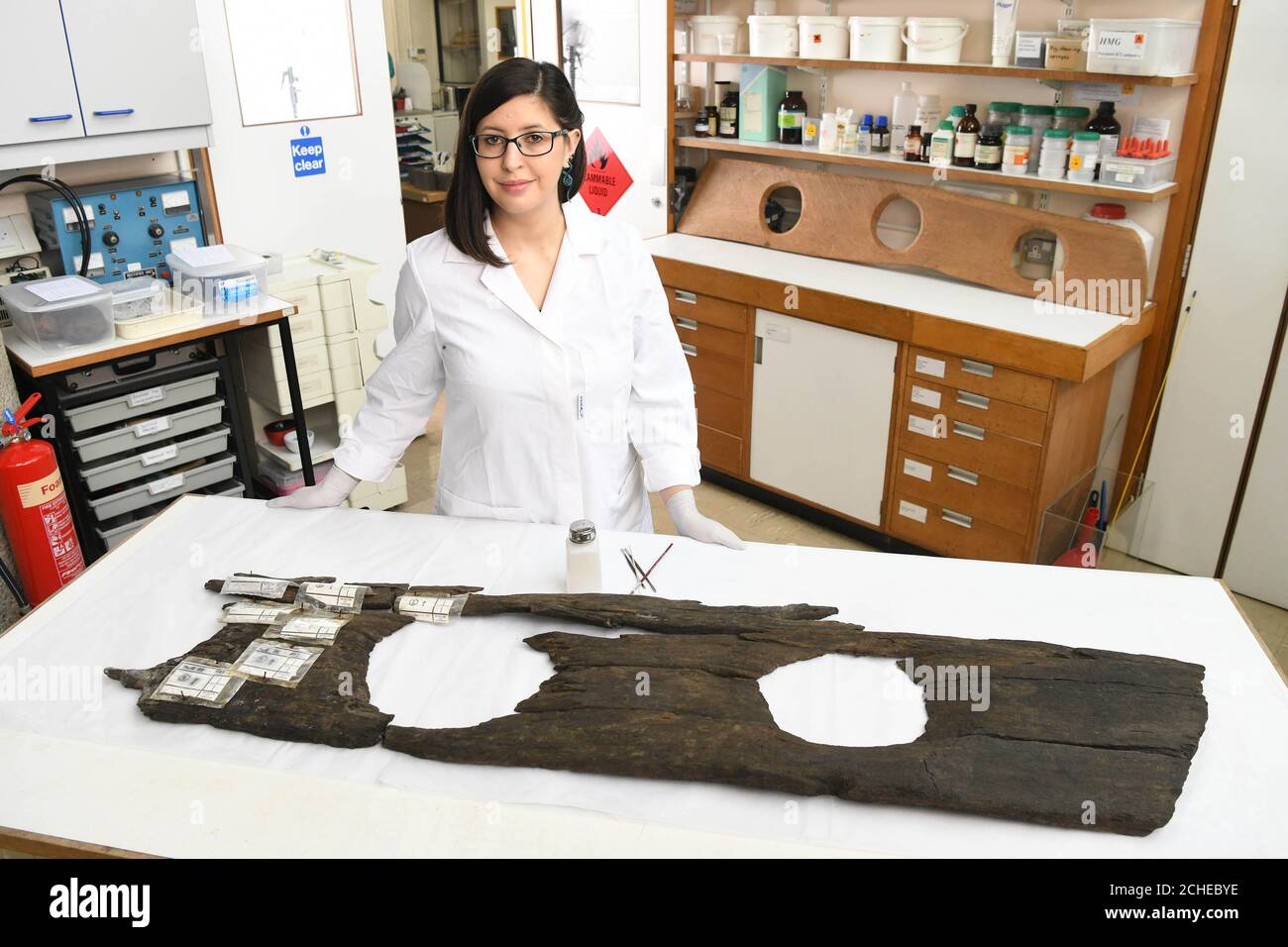 EDITORIAL USE ONLY Conservator Luisa Duarte works on a 12th century ...