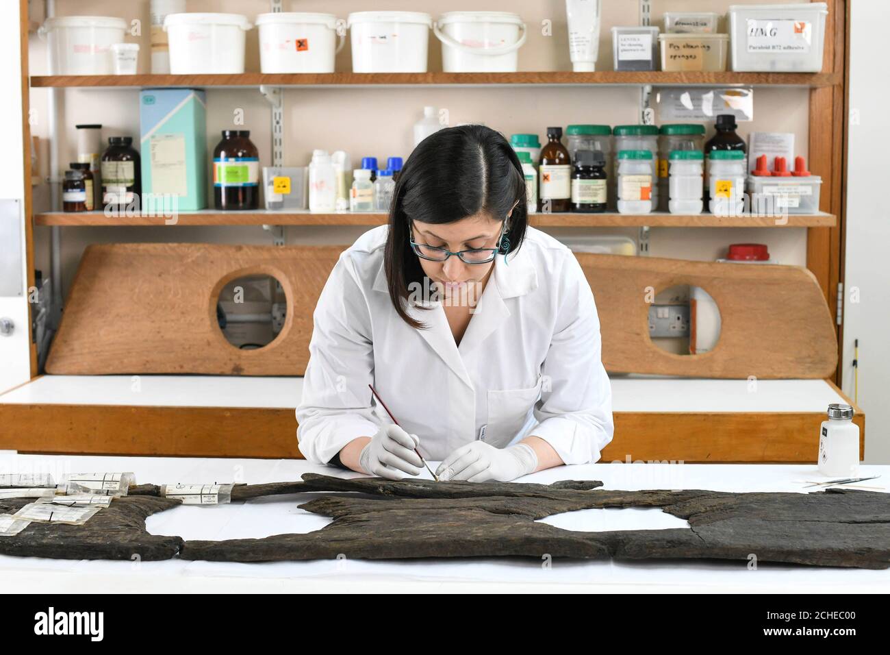 EDITORIAL USE ONLY Conservator Luisa Duarte works on a 12th century ...
